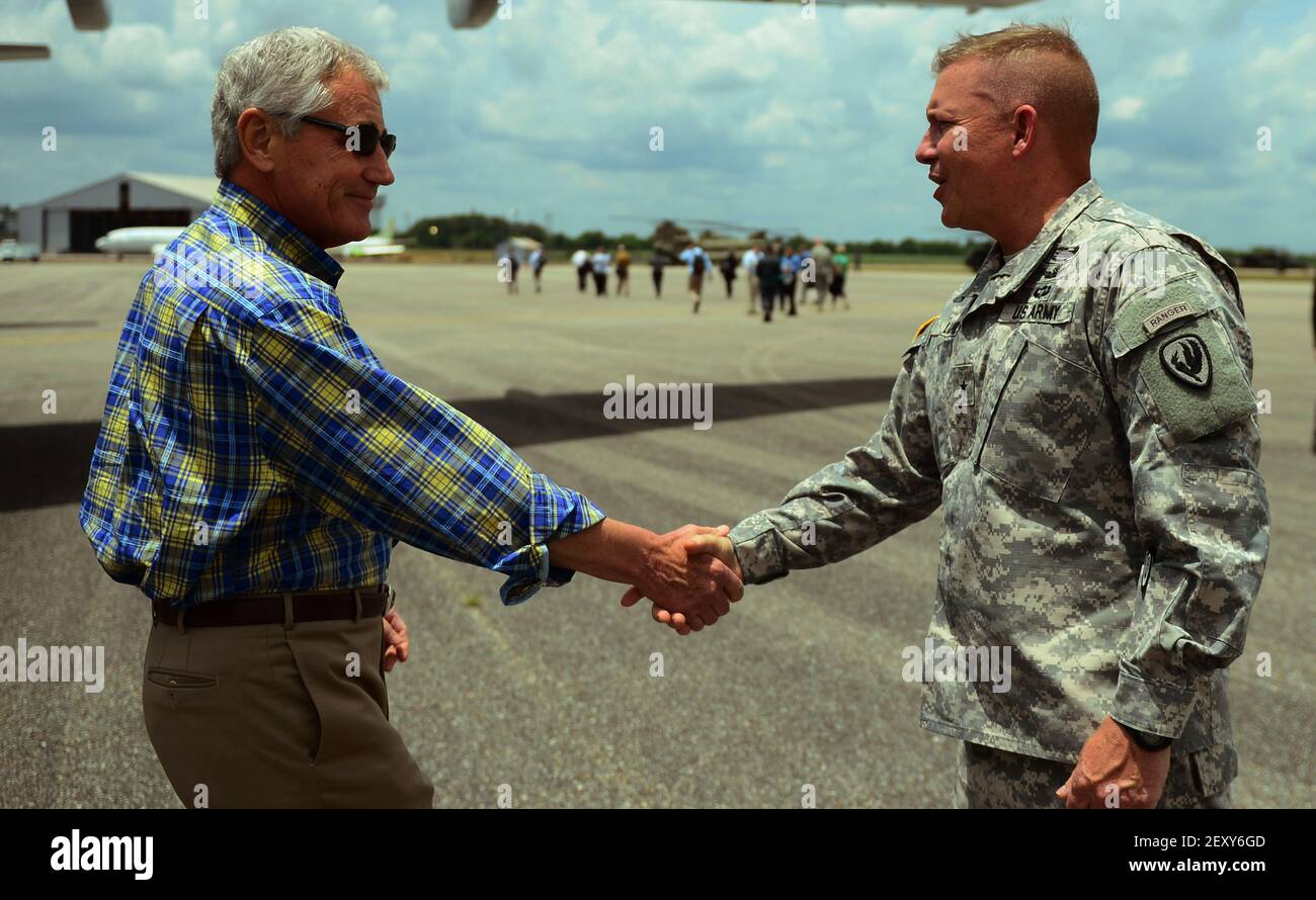 Secretary of Defense Chuck Hagel, is greeted by Brig. Gen. Michael ...
