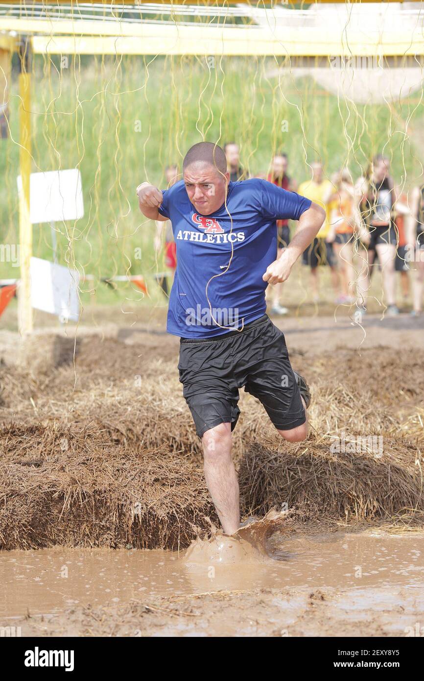 Participants cross the obstacle "Electric Eel" equipped with electric ...