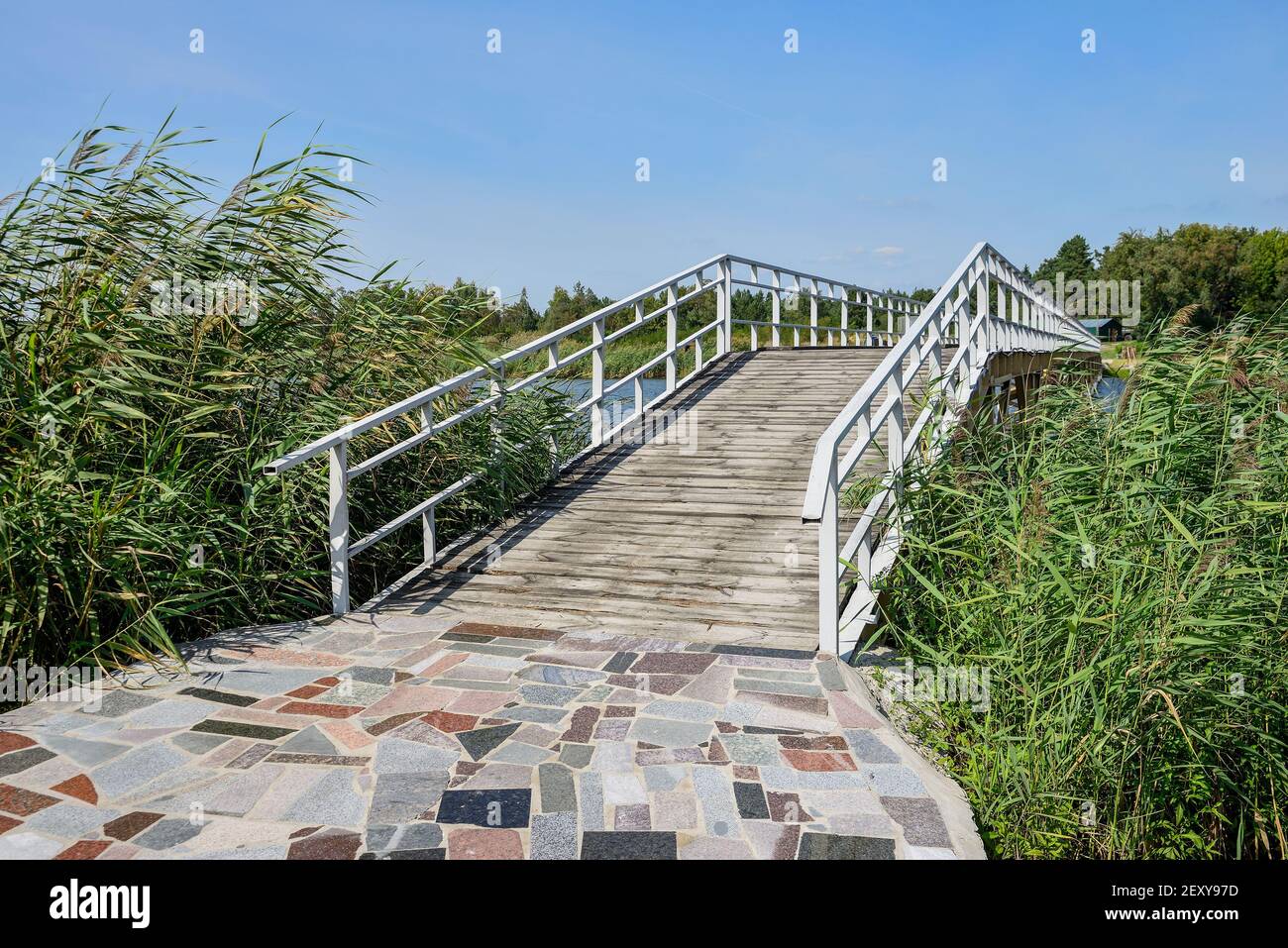 wooden bridge across the river Stock Photo - Alamy