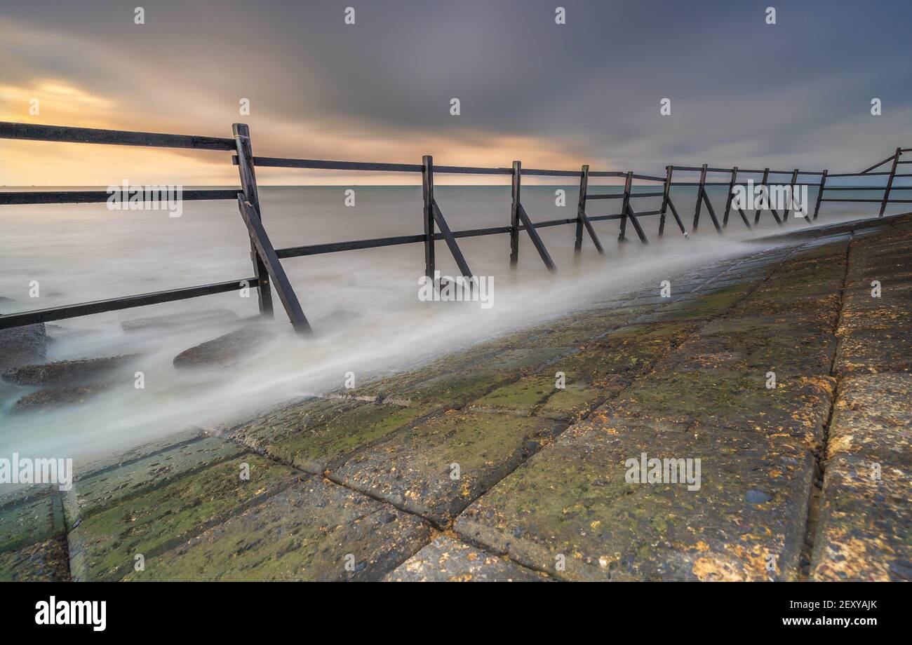 A wooden fence at sunrise in the Banua Patra Beach, Balikpapan, East ...