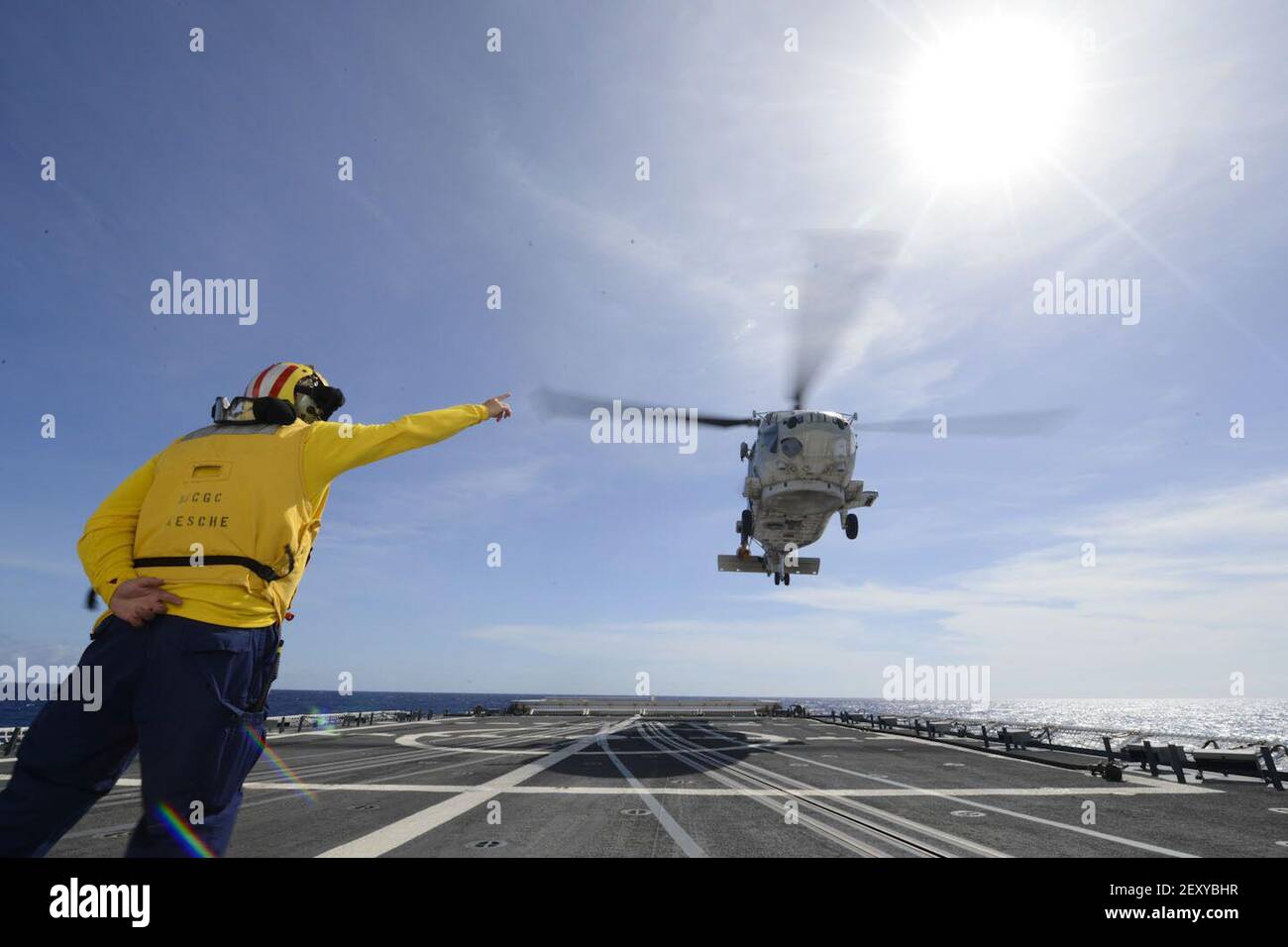 U.S. Coast Guard Ensign Alex Hamel, a landing signals officer aboard ...