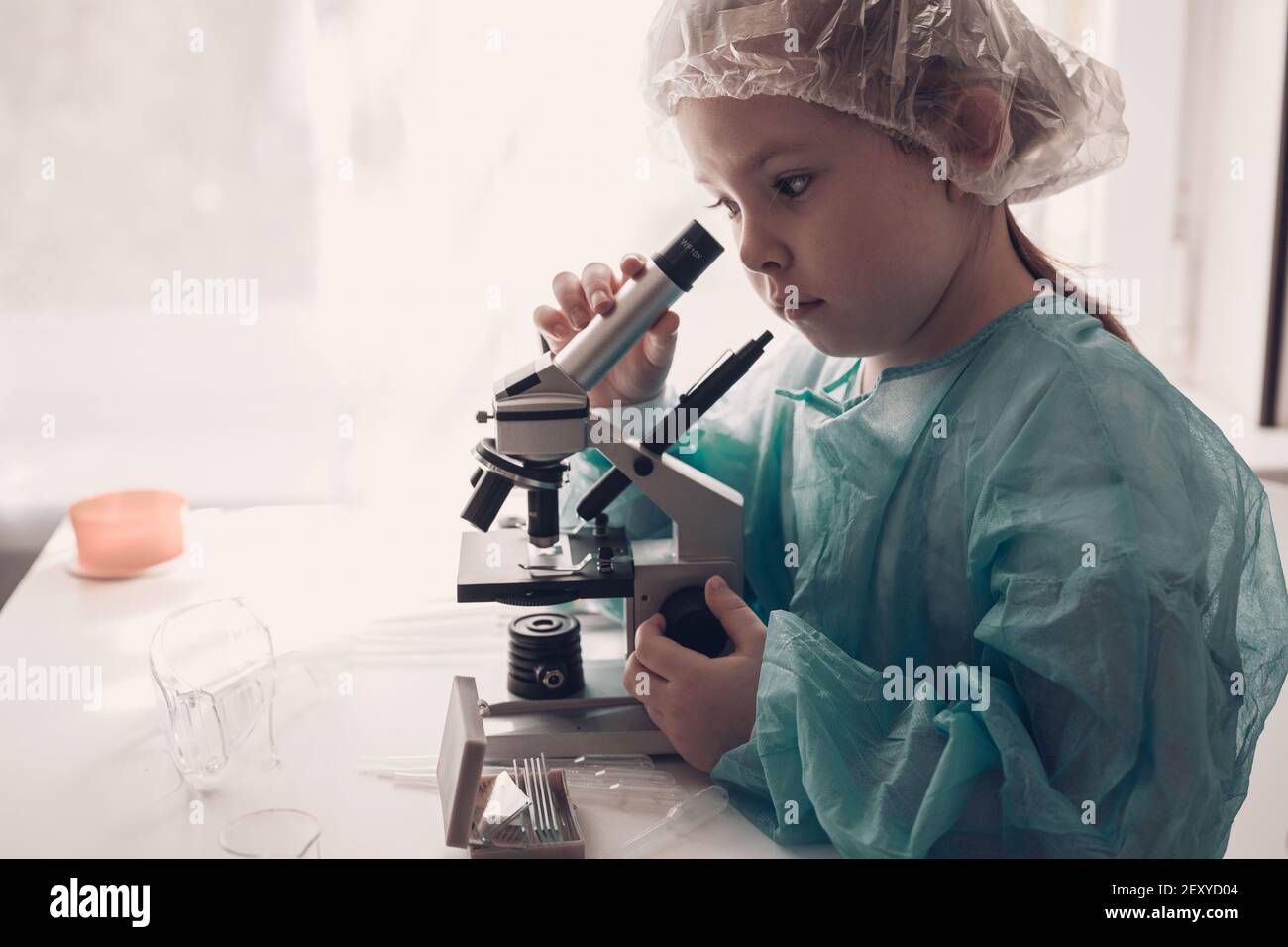 Girl in lab coat hi-res stock photography and images - Alamy