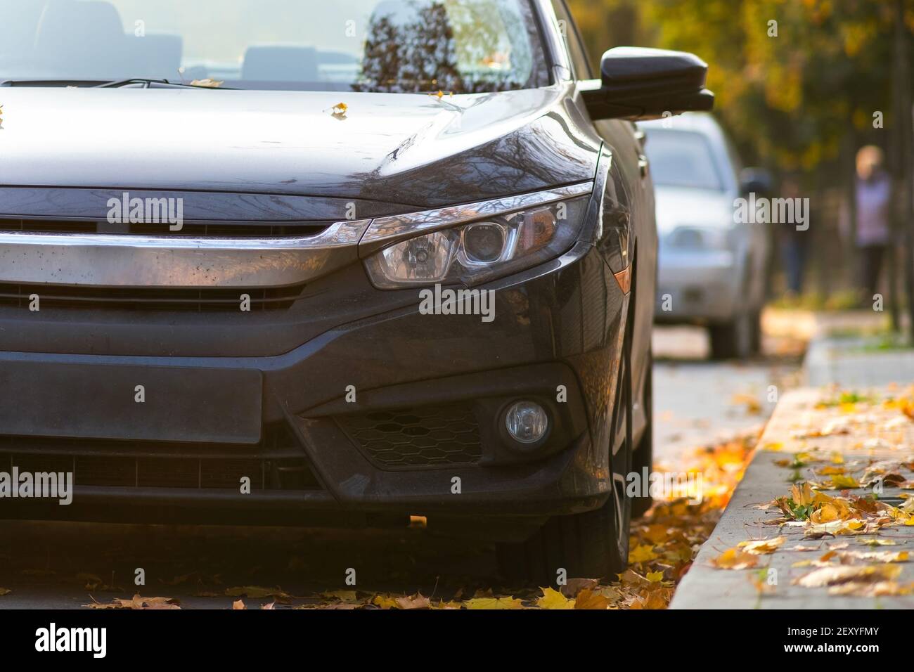 New clean car parked on a city street side Stock Photo - Alamy