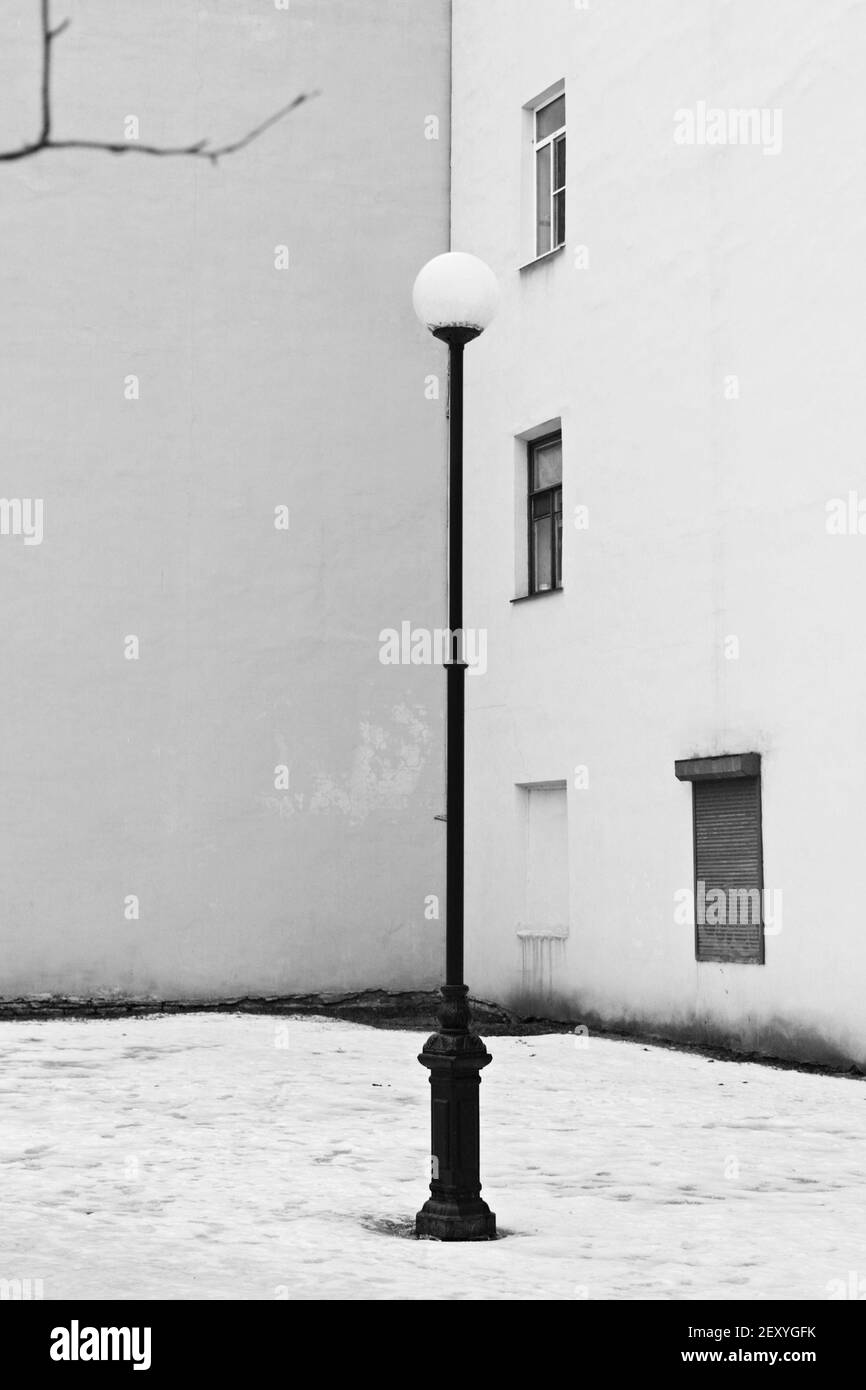 Lamp pole in dark corner of courtyard in old city Stock Photo - Alamy