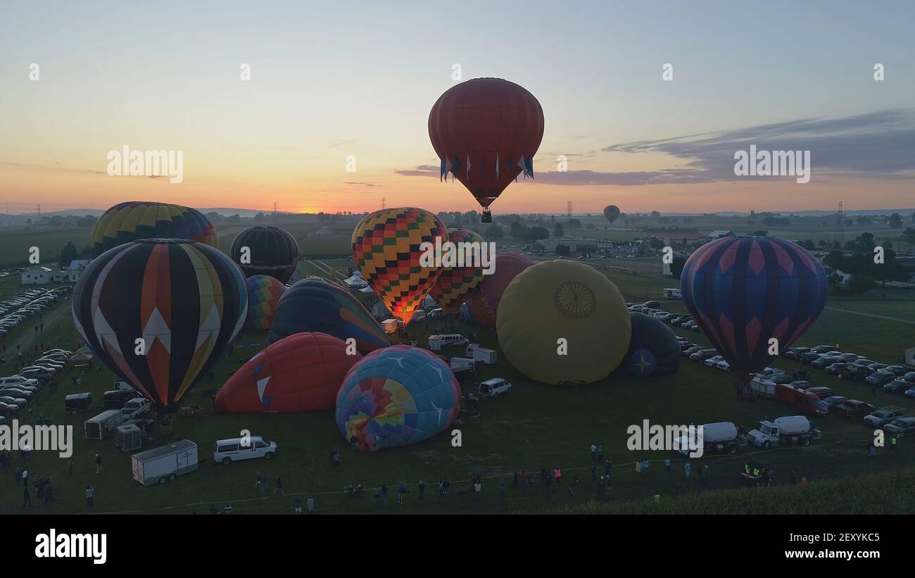 Hot Air Balloons Taking Off at Sunrise at a Hot Air Balloon Festival on ...