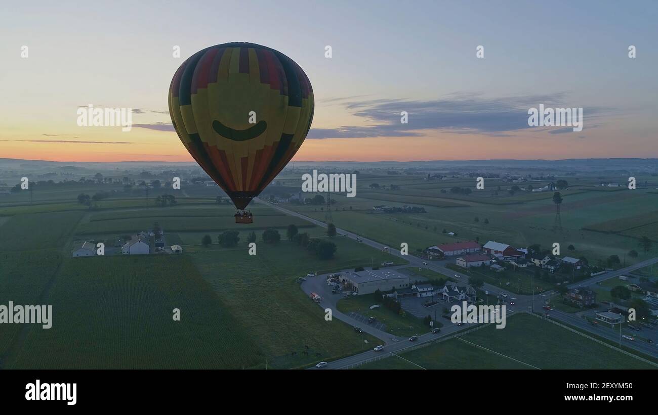 Hot Air Balloons Taking Off at Sunrise at a Hot Air Balloon Festival on ...