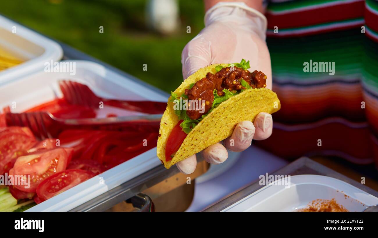 Chef making tacos at a street cafe Stock Photo - Alamy