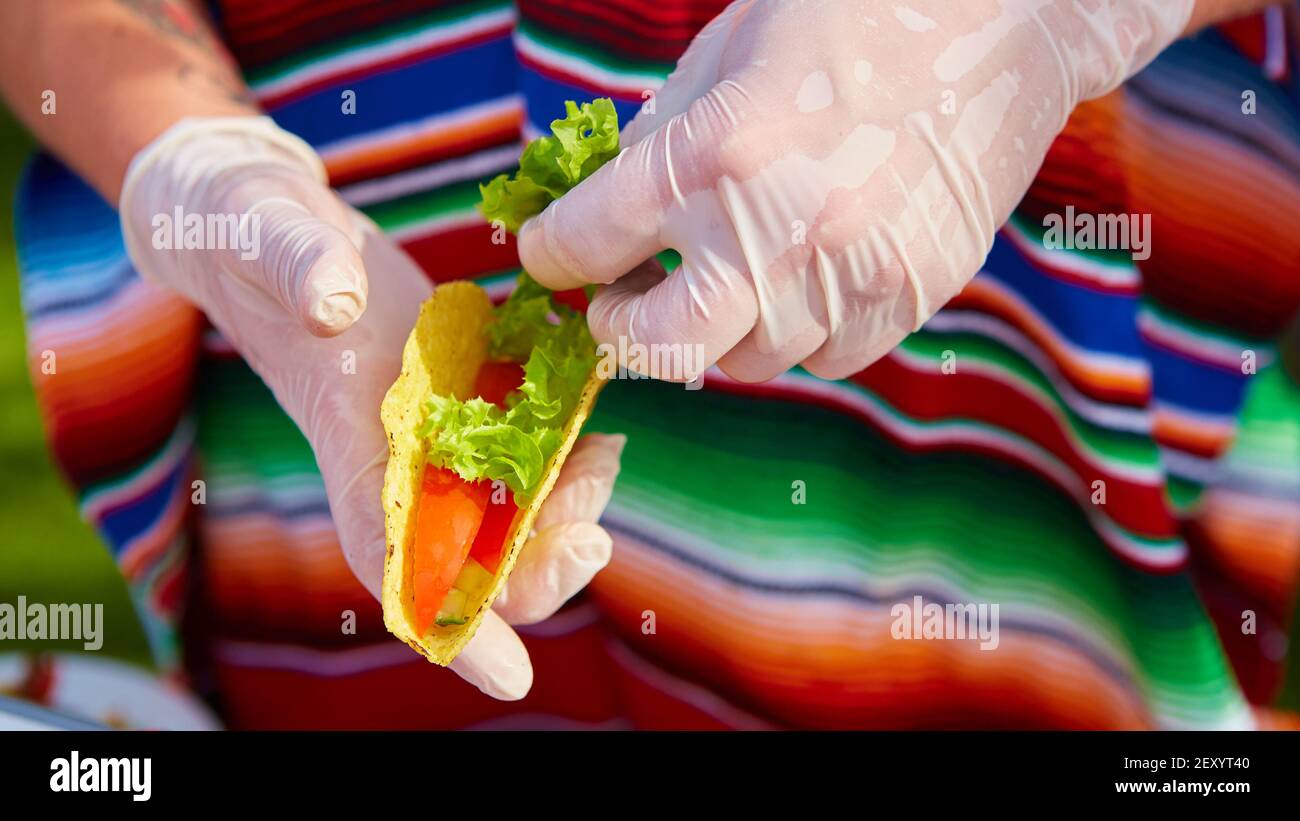 Chef making tacos at a street cafe Stock Photo - Alamy