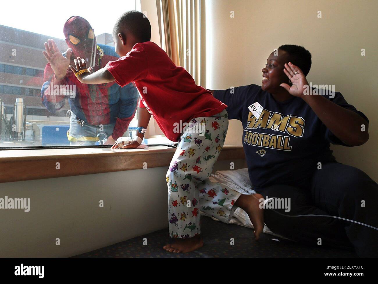 Matt "Spider-Man" McGehee visits with patient Isaiah Bush as he and his ...
