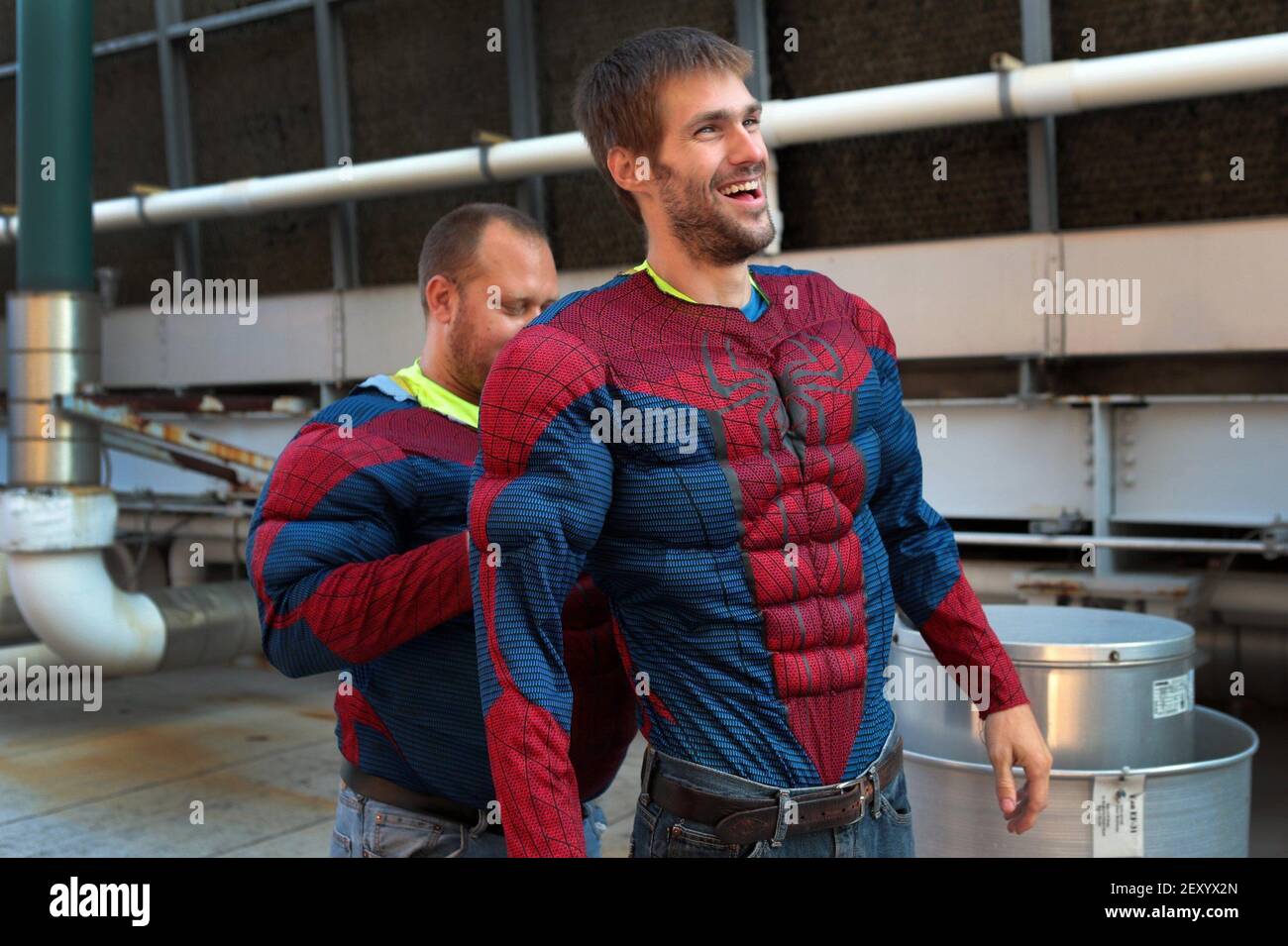 Matt "Spider-Man" McGehee, left, helps Andy Weeks with his own Spider ...