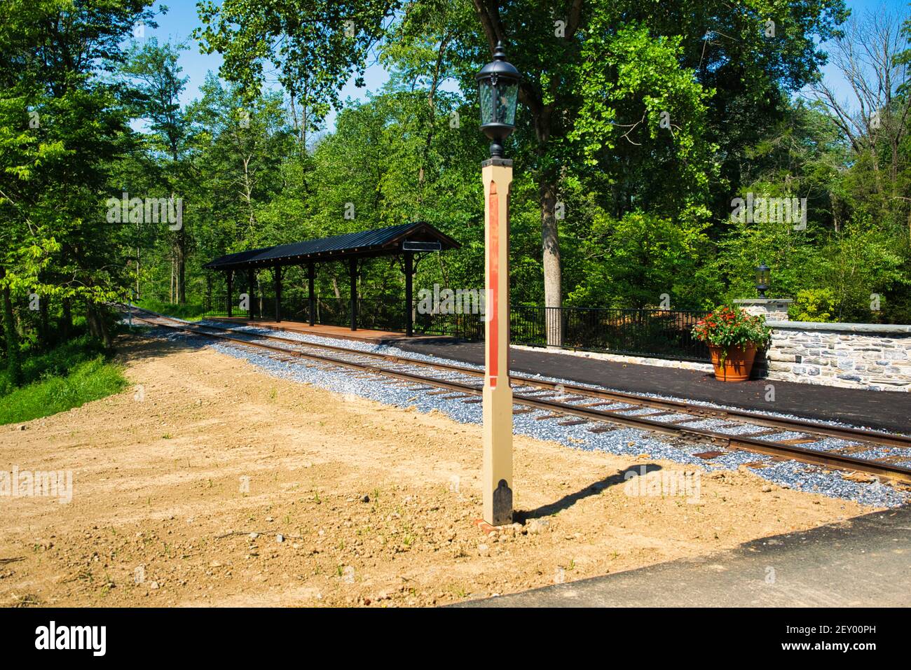 A Small Train Station Waiting for Passengers and a Train Stock Photo ...