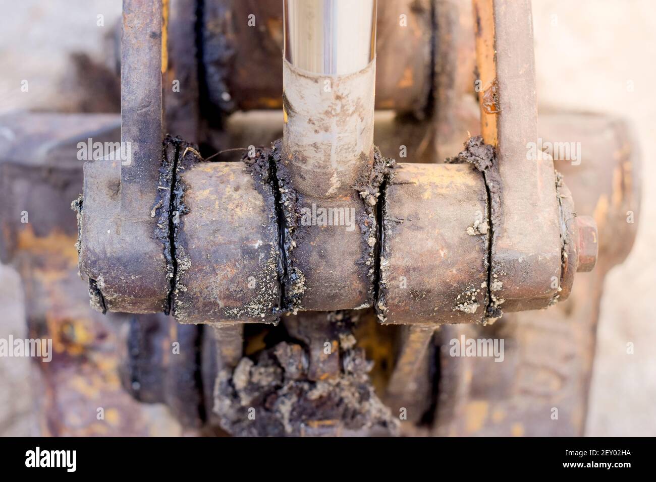 Closeup backhoe arm joints and grease stains on them Stock Photo - Alamy