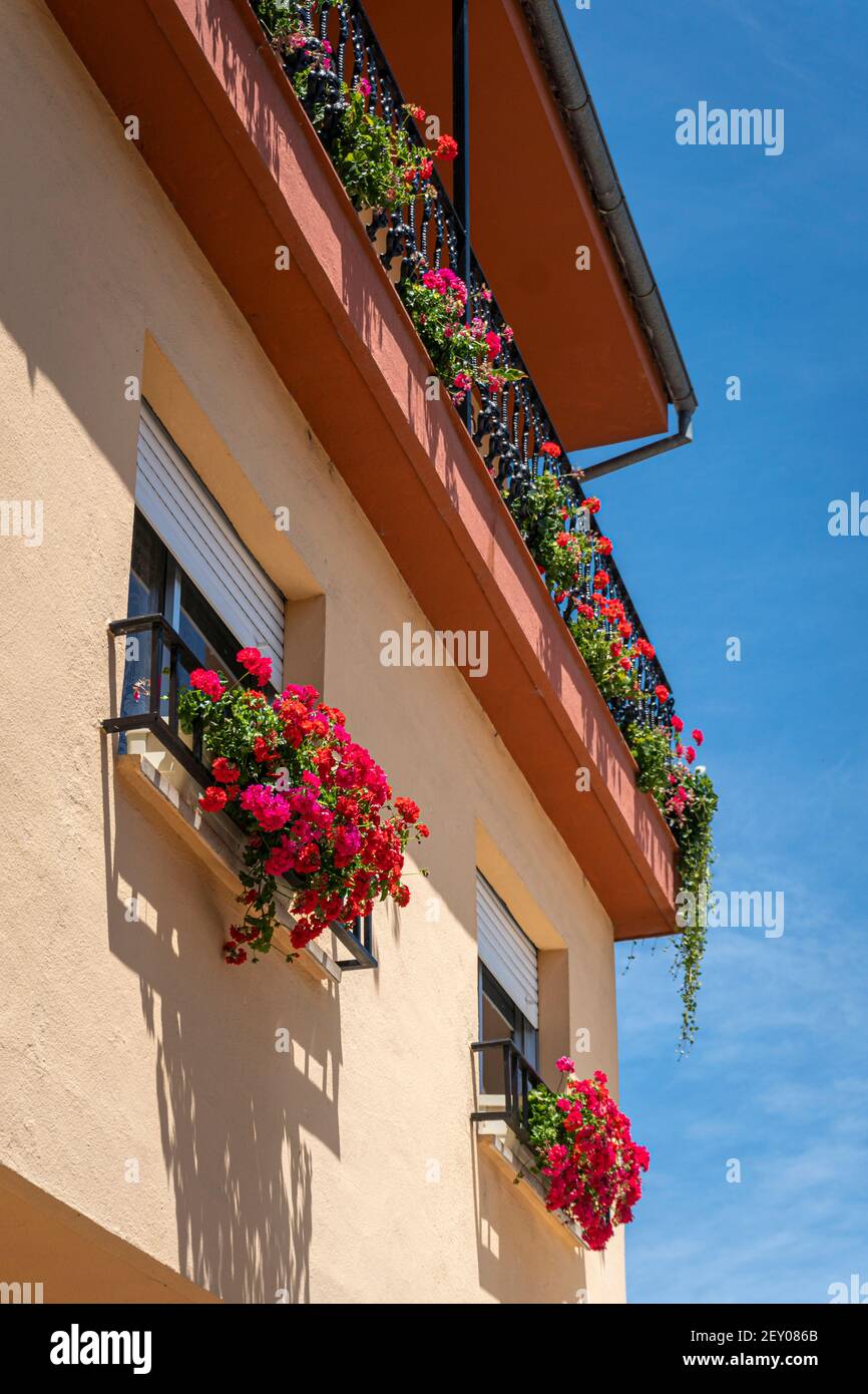 Pretty geranium flowers on balconies on a spanish villa, Spain Stock ...