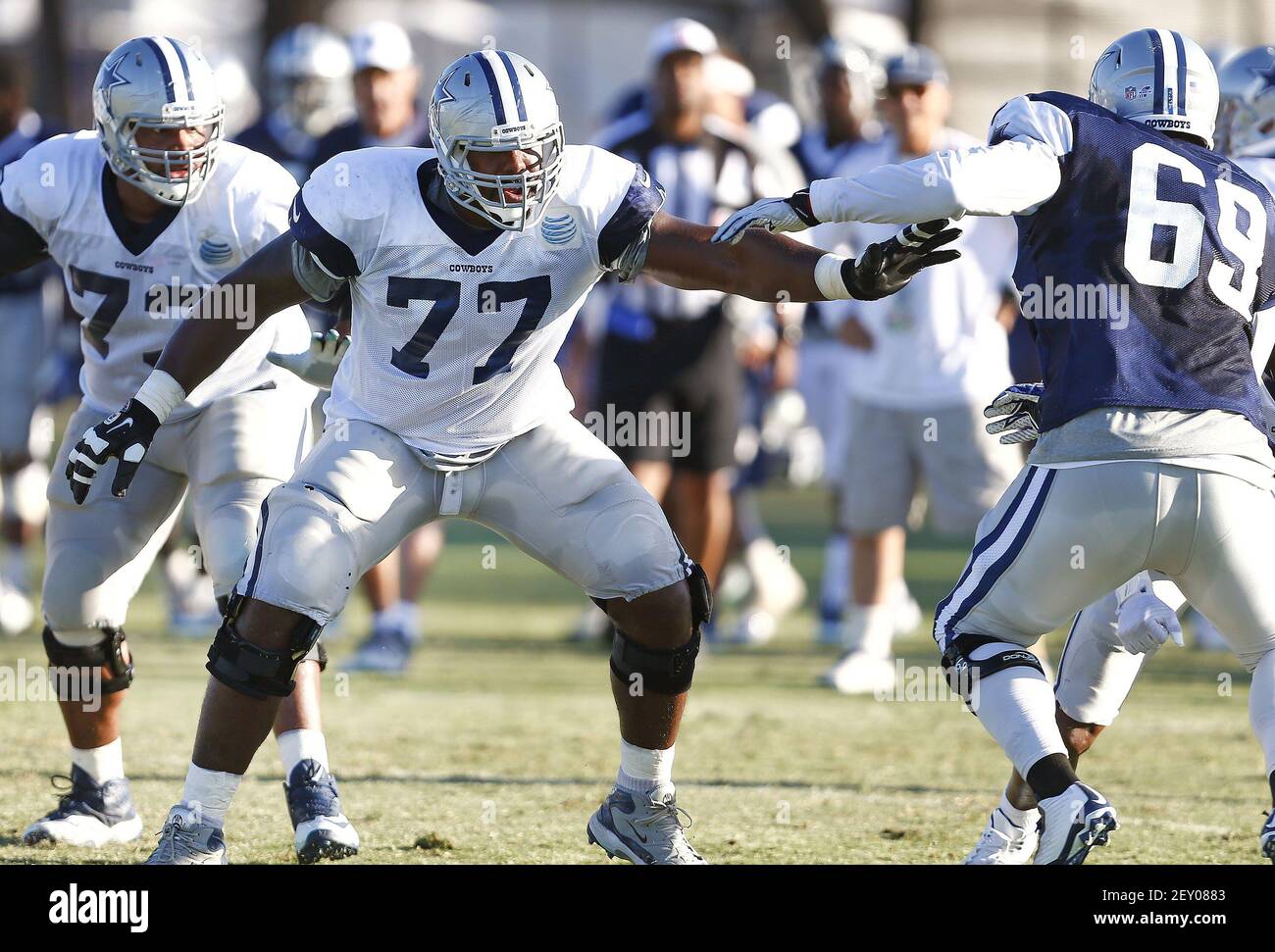 Dallas Cowboys tackle Tyron Smith (77) drills with defensive tackle ...