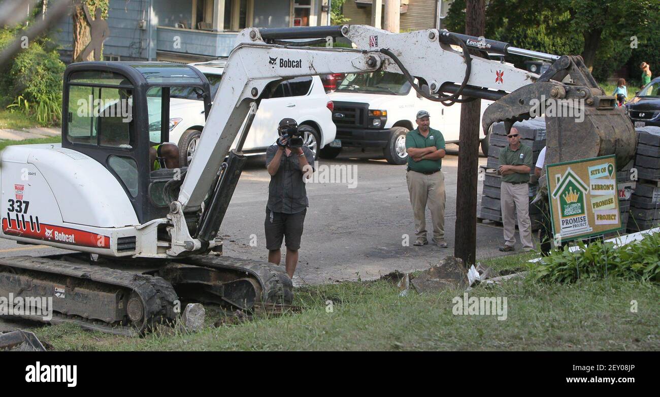 LeBron James operates an excavator as a camera operator and Darren ...