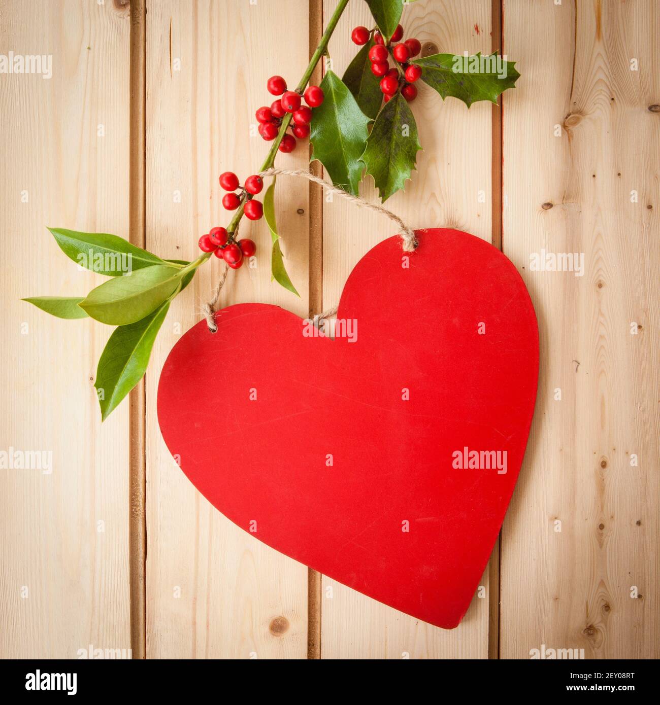 Christmas decoration with holly Stock Photo - Alamy