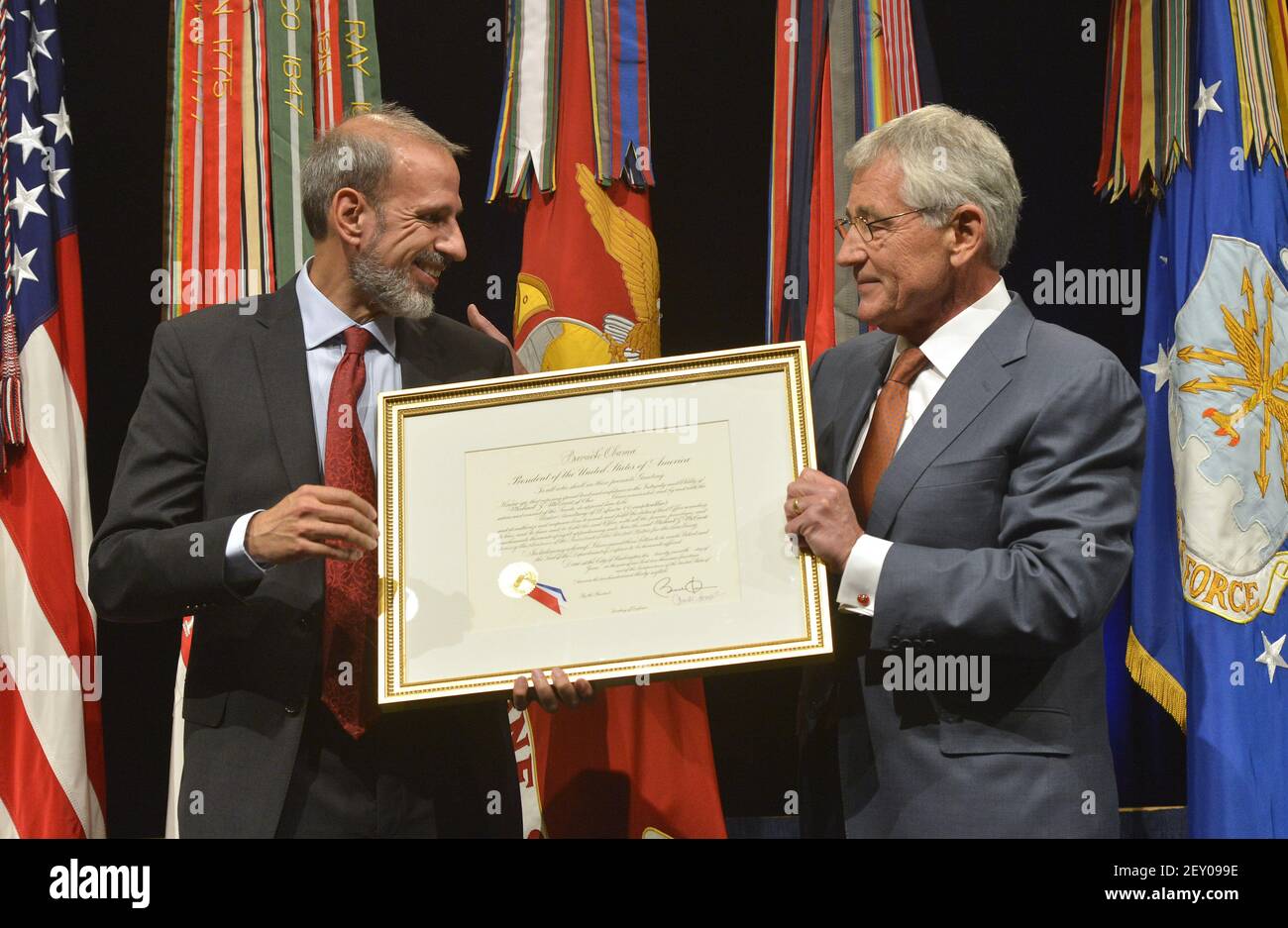 Secretary of Defense Chuck Hagel presents Under Secretary of Defense ...