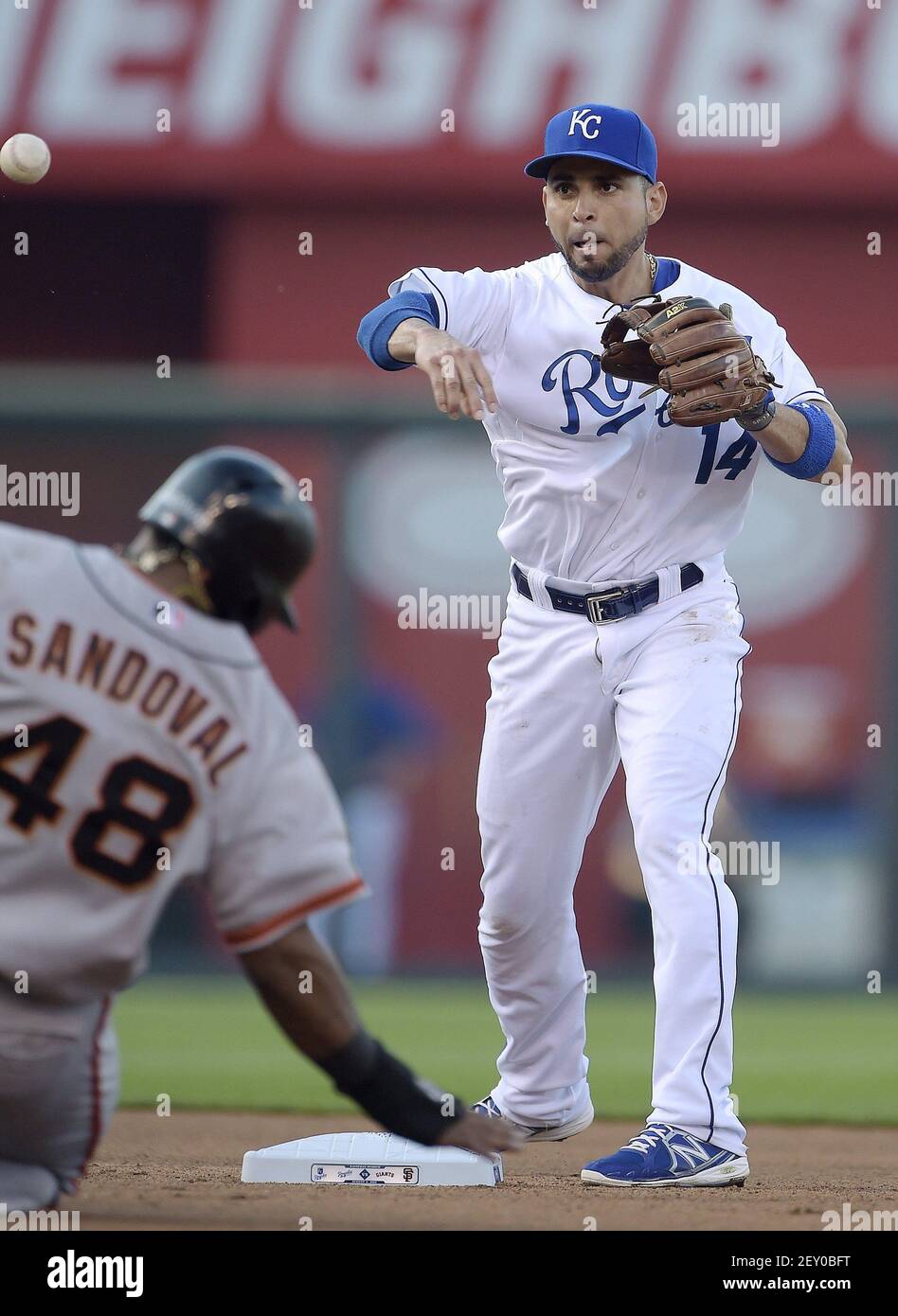 Kansas City Royals second baseman Omar Infante forces out the San ...