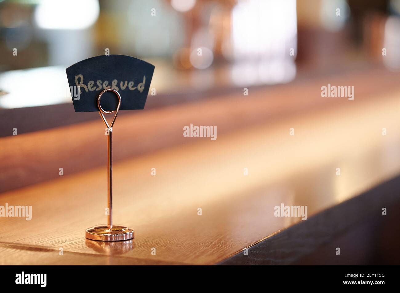 Plaque with the inscription reserved on the bar counter in the ...