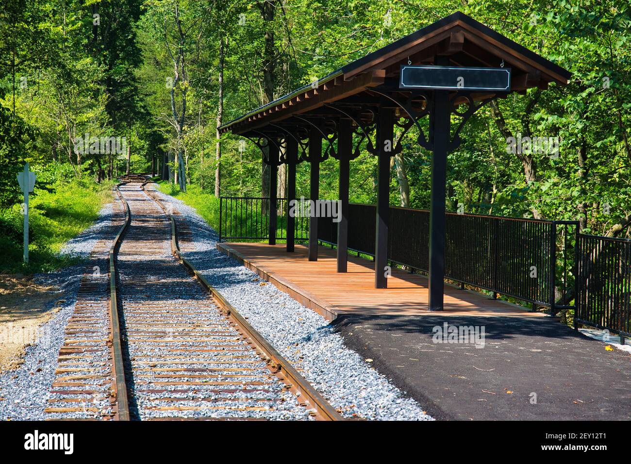 A Small Train Station Waiting for Passengers and a Train Stock Photo ...