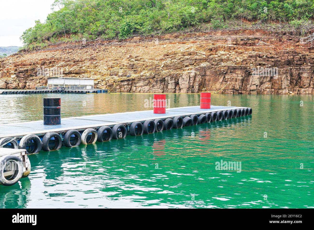 Floating platform made of barrels and tires in the middle of the lake ...