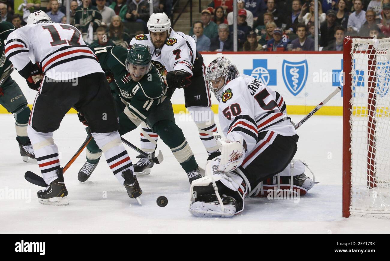 The Minnesota Wild's Zach Parise (11) fights to get past the Chicago ...