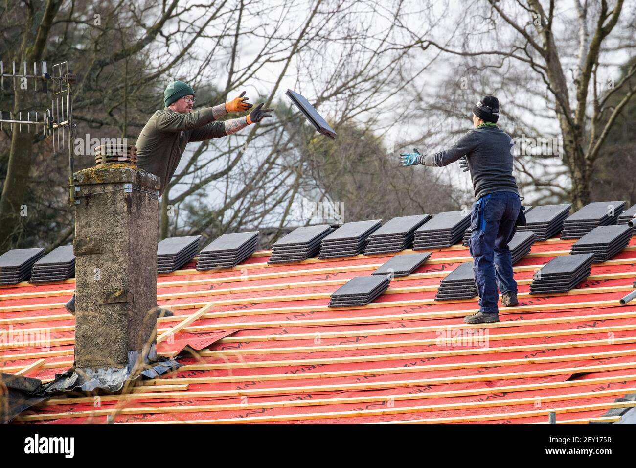 Roofing tiles man hi-res stock photography and images - Alamy