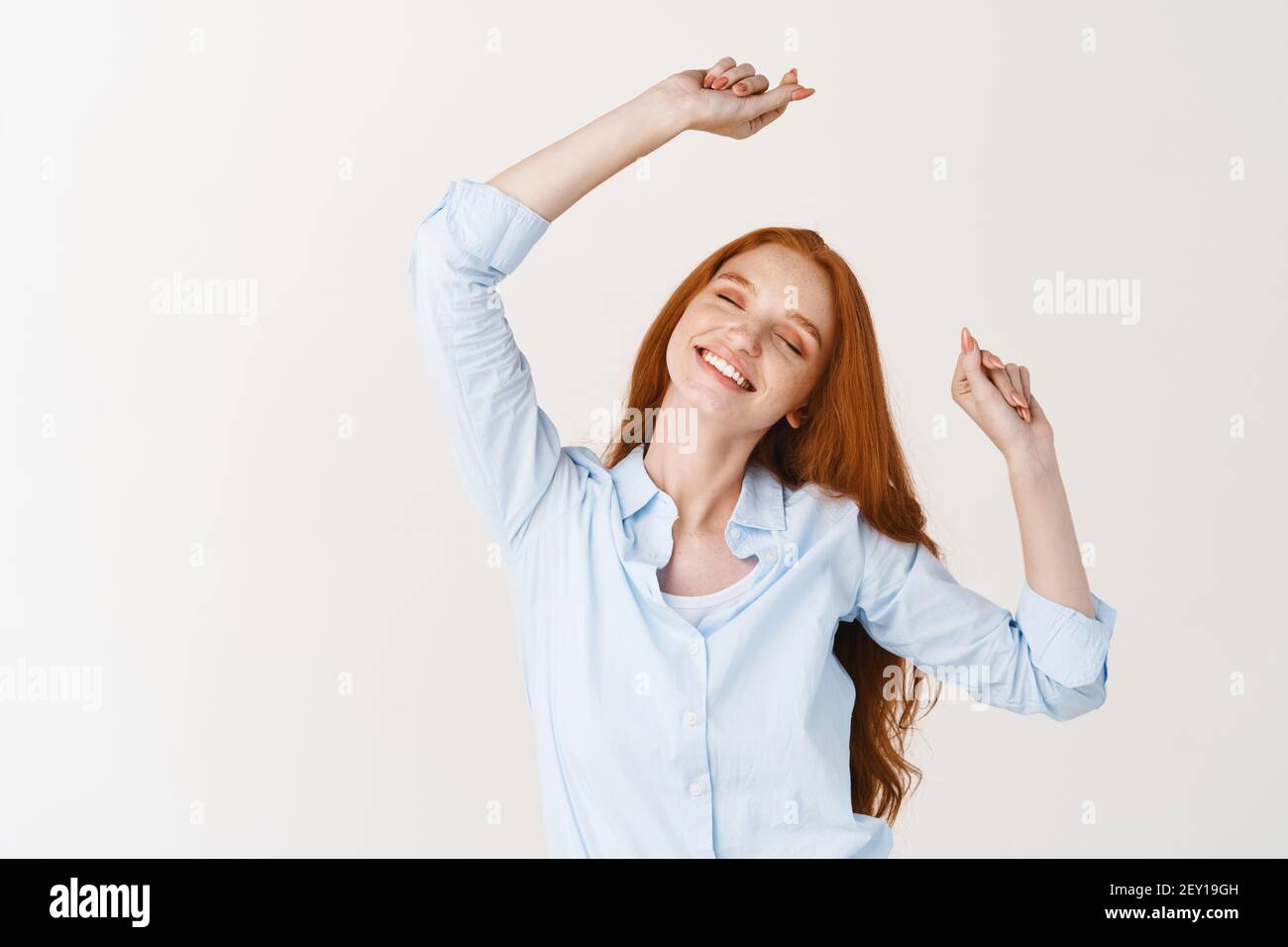 Image of beautiful girl with long red hair snap fingers and dancing ...