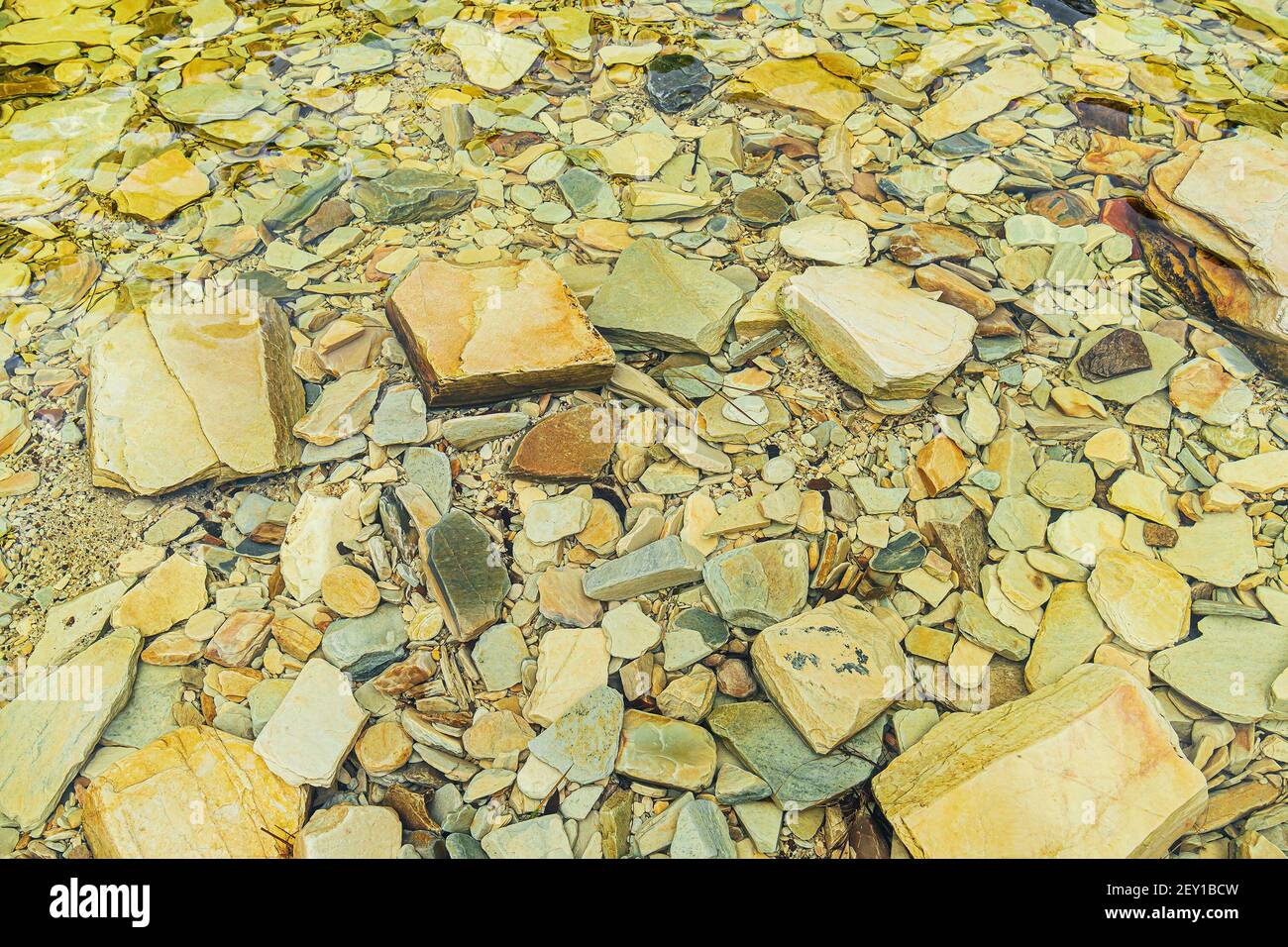 Underwater sedimentary rocks. Rocks in different shapes submerged on a ...