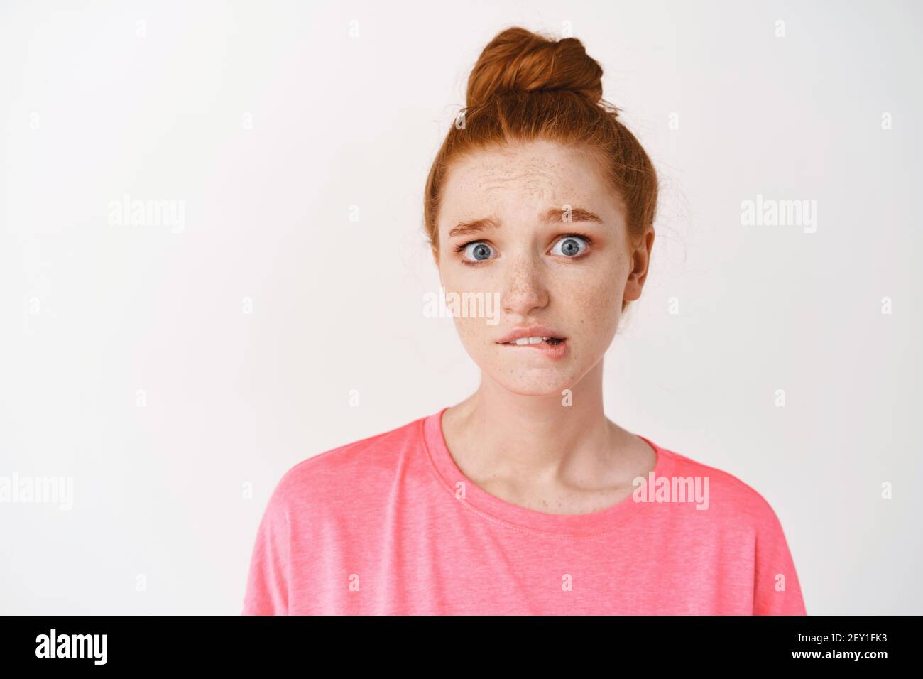 Skincare and makeup concept. Close-up of insecure and worried redhead ...