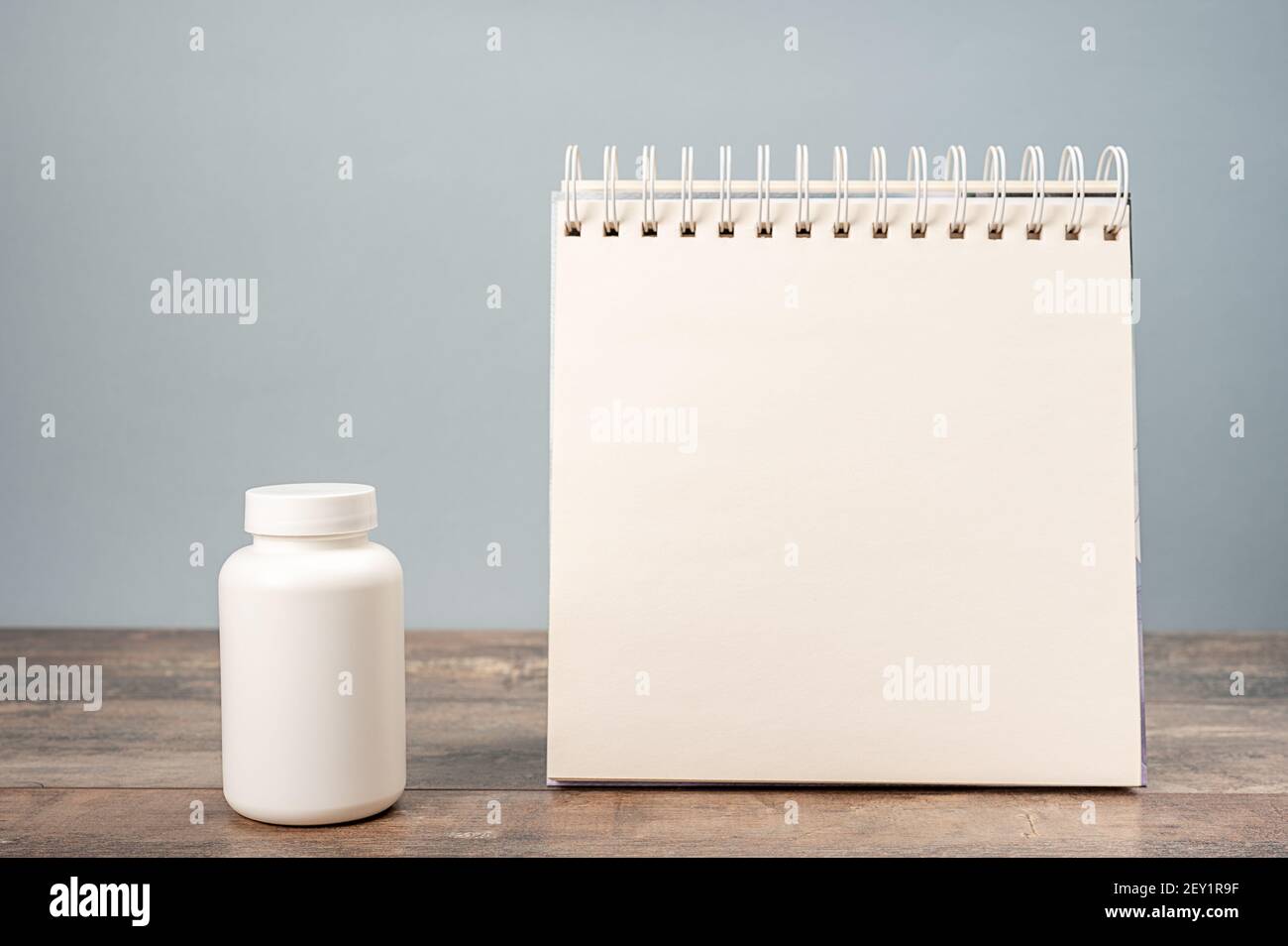 jar of pills and a mockup of notepad for writing down the prescription ...