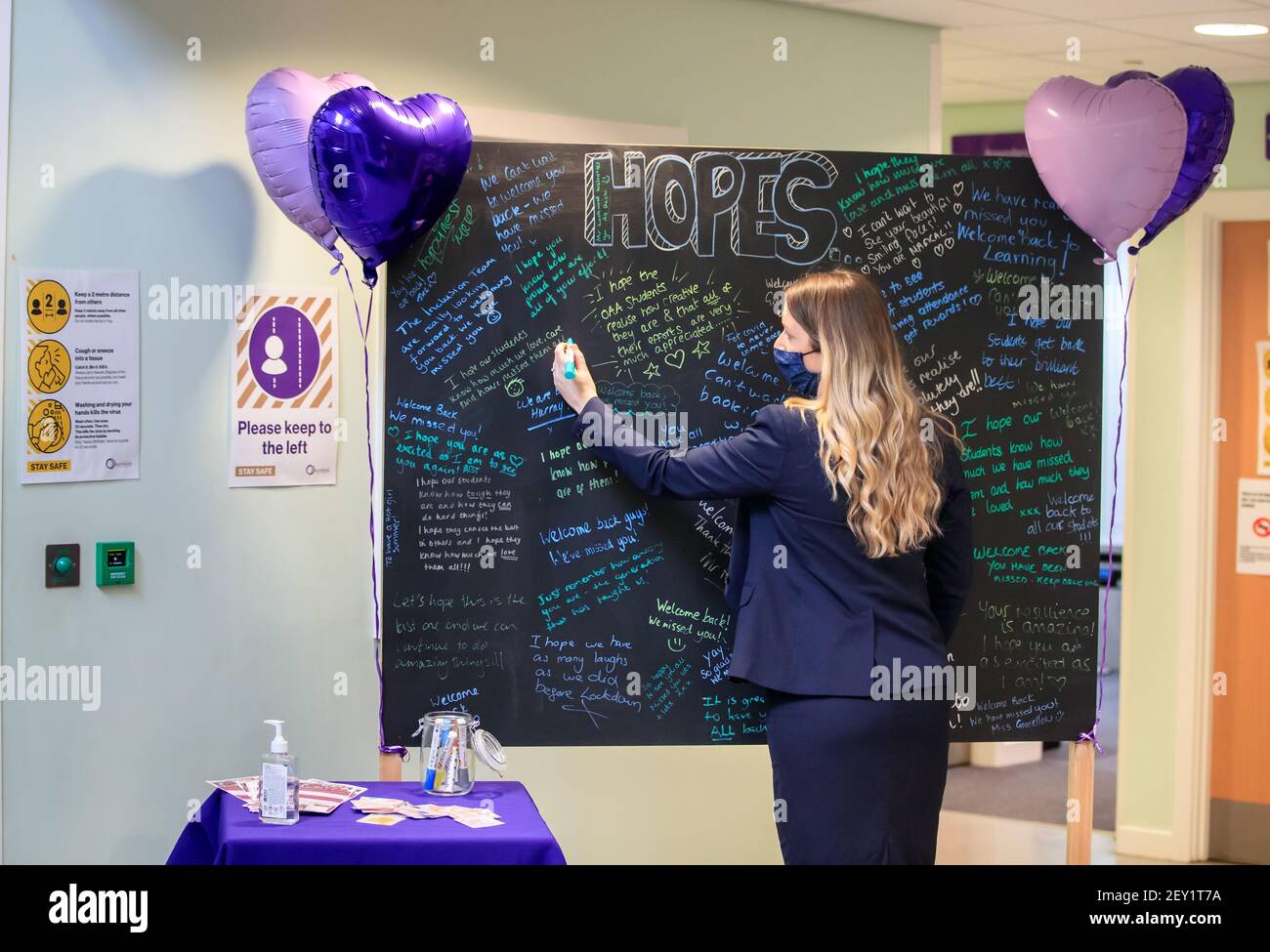 Associate vice principal Hannah Smith writing a welcome back messages ...