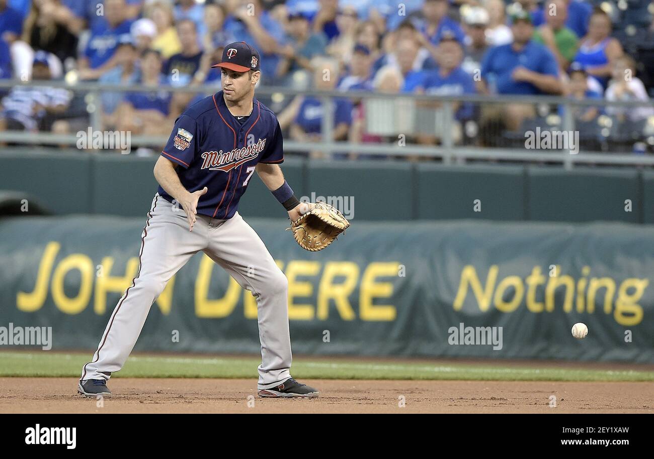 Minnesota Twins first baseman Joe Mauer looks for the ball that bounced ...