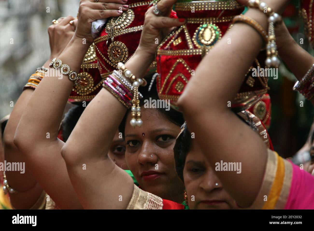 Indian women take part in a religious procession during the "Ganesh ...