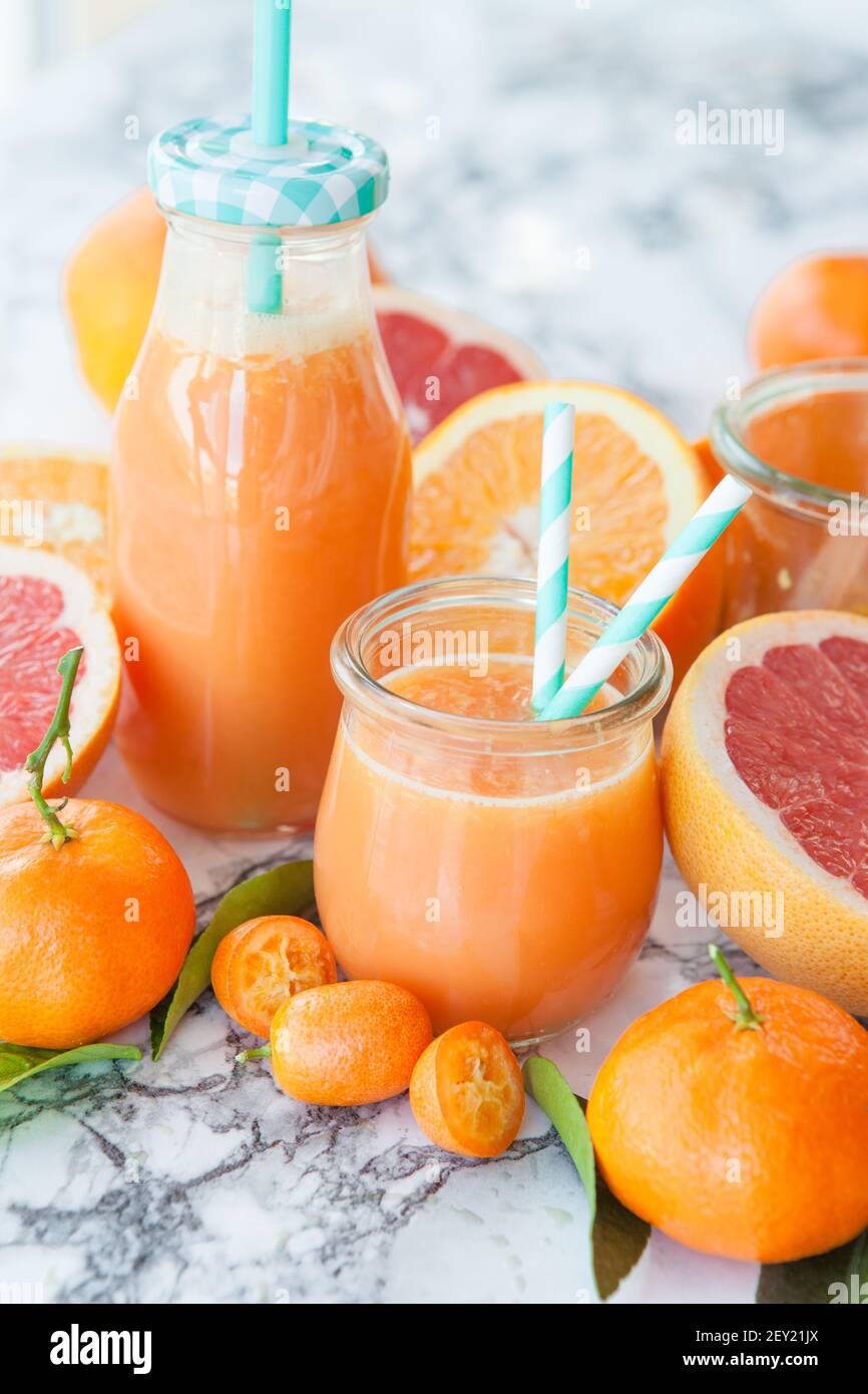 Juice with fresh citrus fruits Stock Photo - Alamy