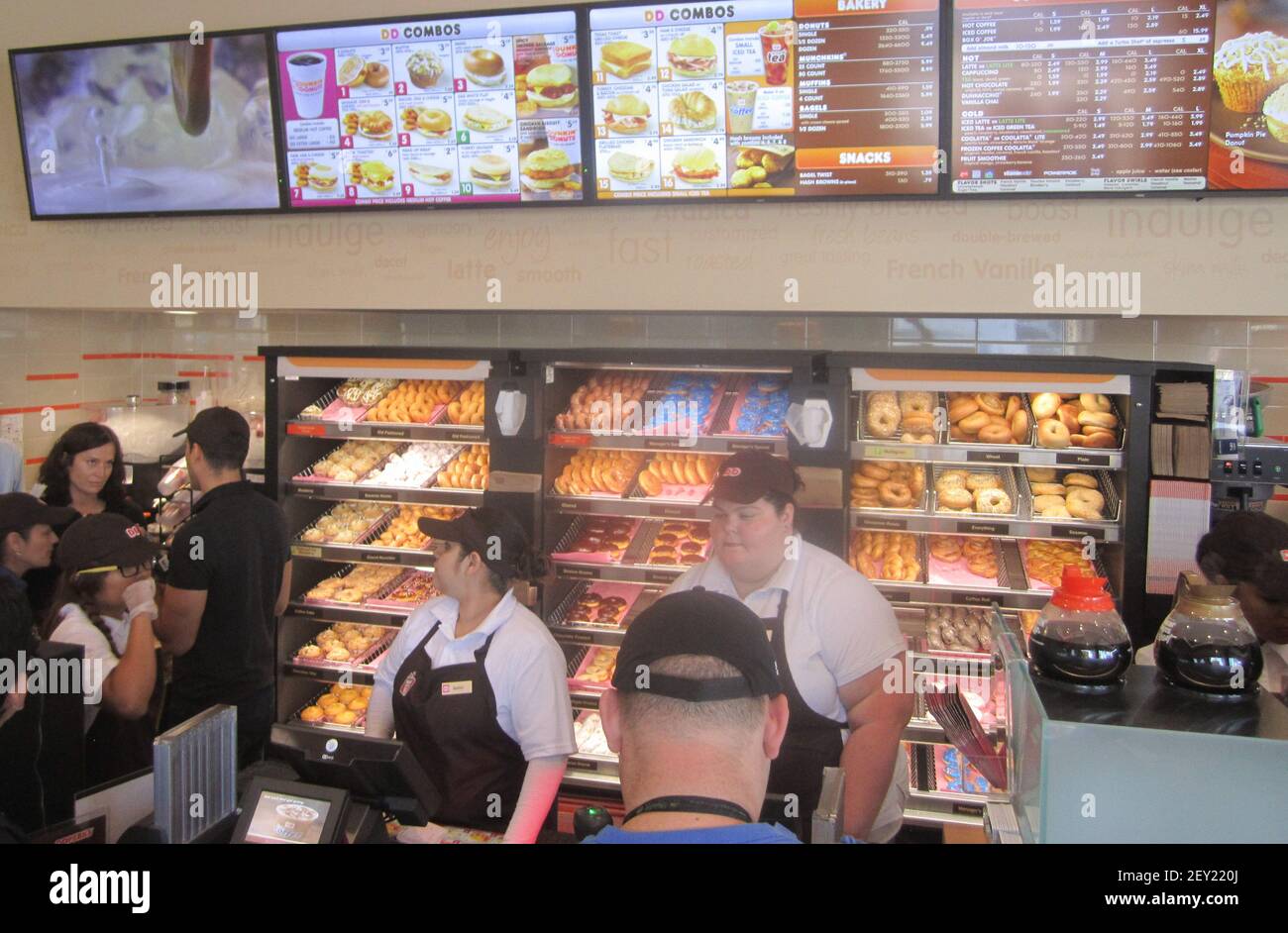Customers and ardent fans of the Dunkin' Donuts chain line up at the ...