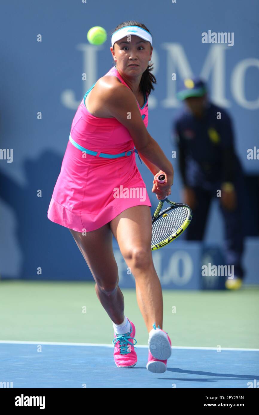 New York NY. Shuai Peng (CHN) hits ball back against Caroline Wozniacki ...