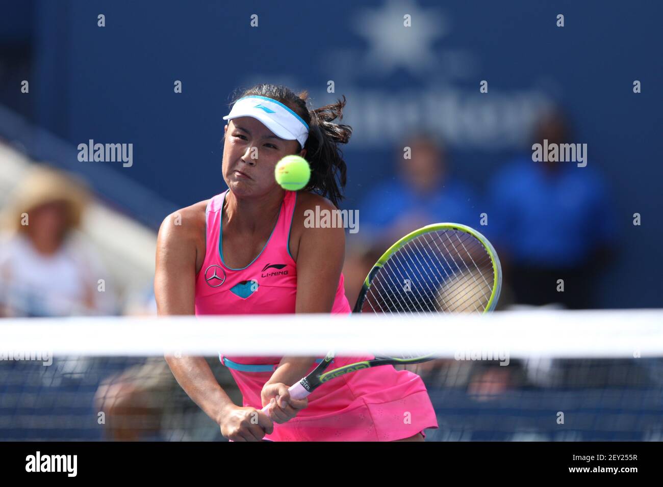 New York NY. Shuai Peng (CHN) hits ball back against Caroline Wozniacki ...