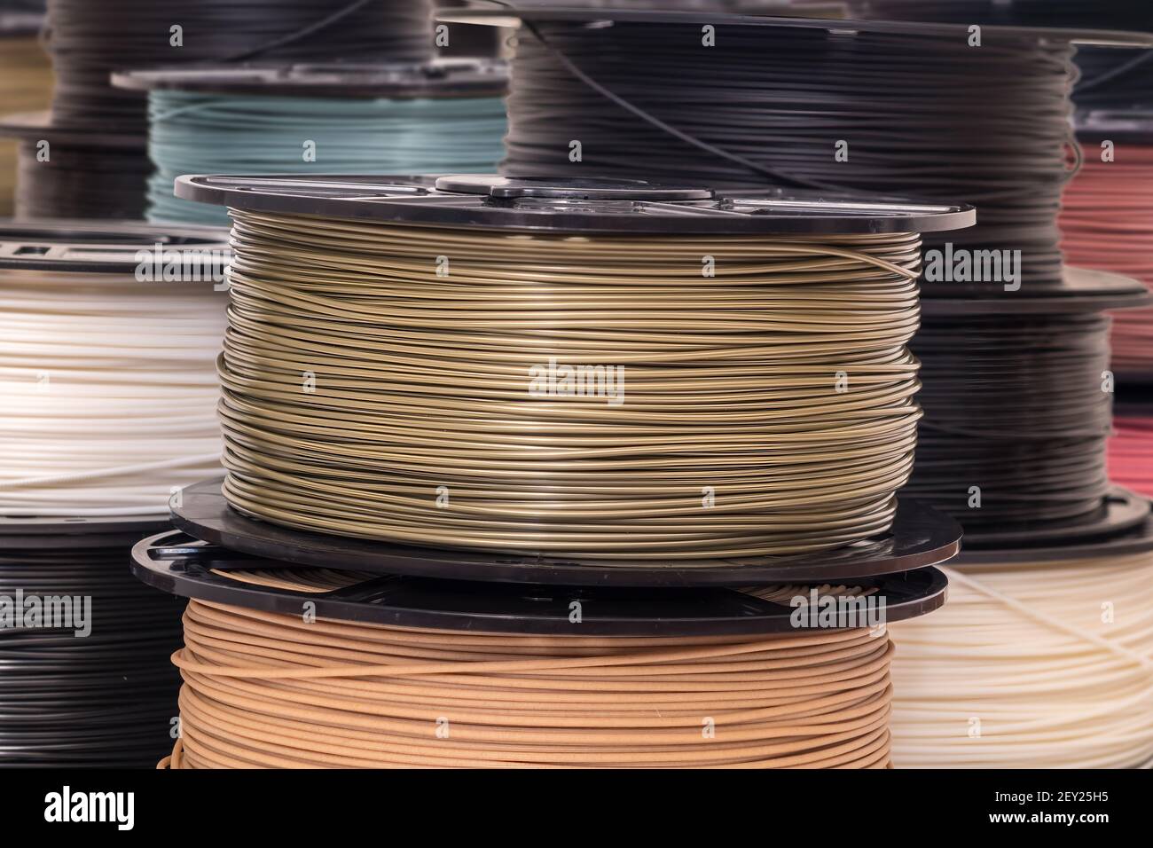 Spool of bronze color PLA plastic filament for 3D printer Stock Photo ...