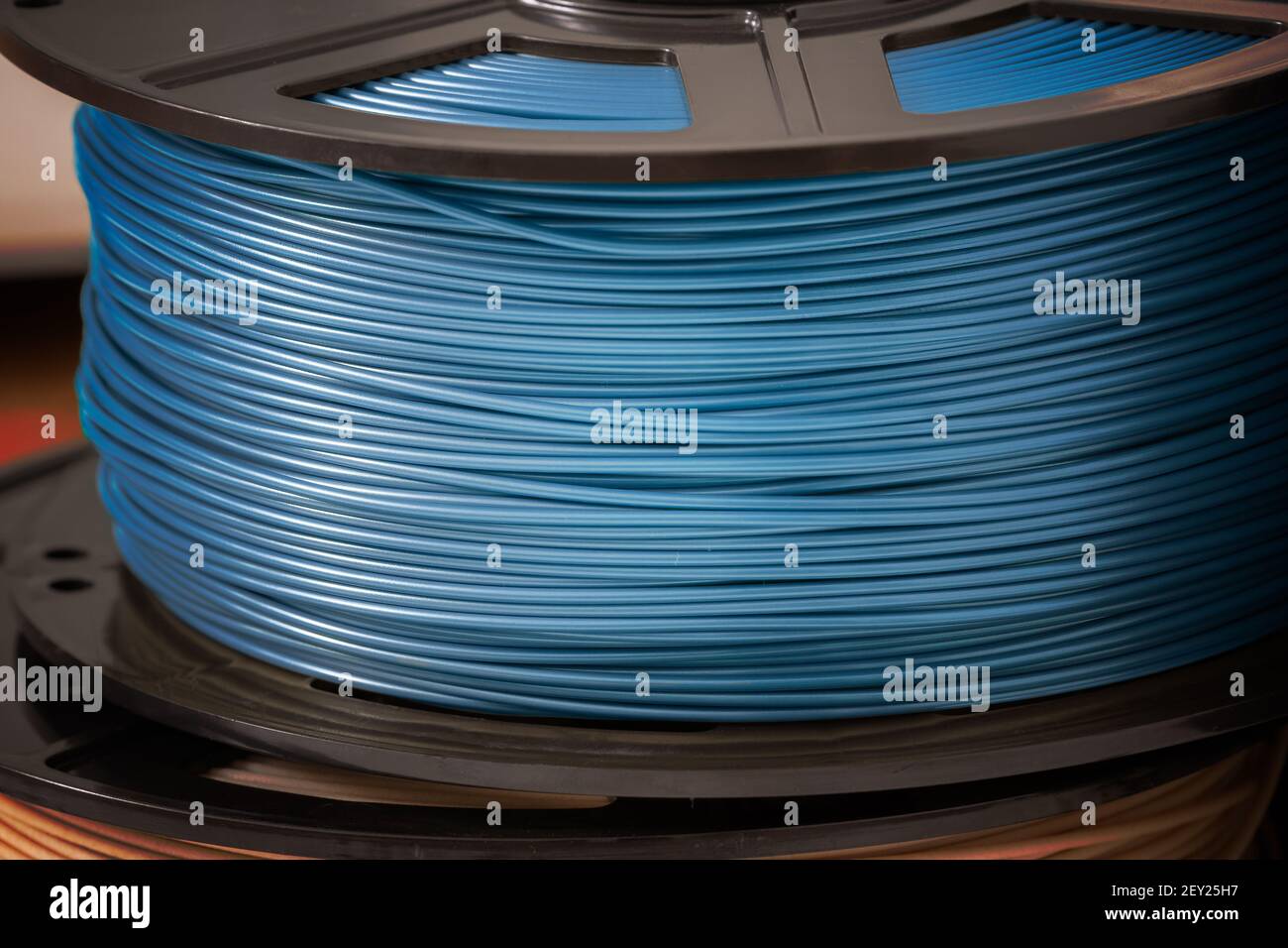 Blue metallic glossy PLA plastic filament for 3D printer Stock Photo ...