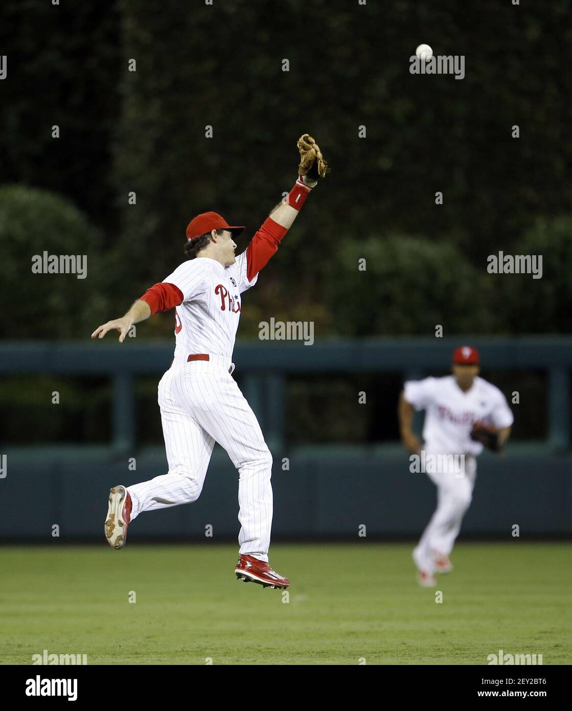 Philadelphia Phillies' Chase Utley tries to catch a single hit by ...