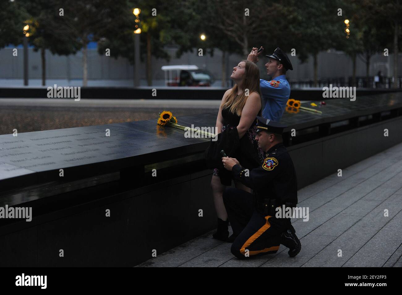 Family members Maggie, Zach and Mitch Ellicott (kneeling), of New ...