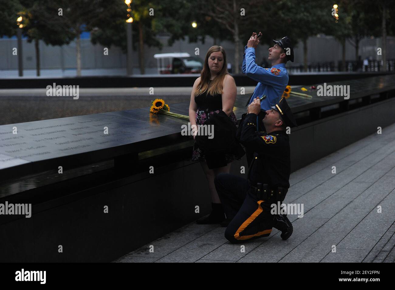Family members Maggie, Zach and Mitch Ellicott (kneeling), of New ...