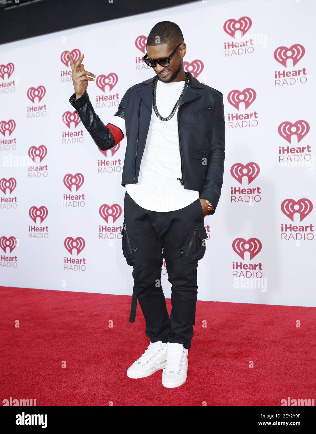 Usher poses for a photo during a red carpet event prior to the ...