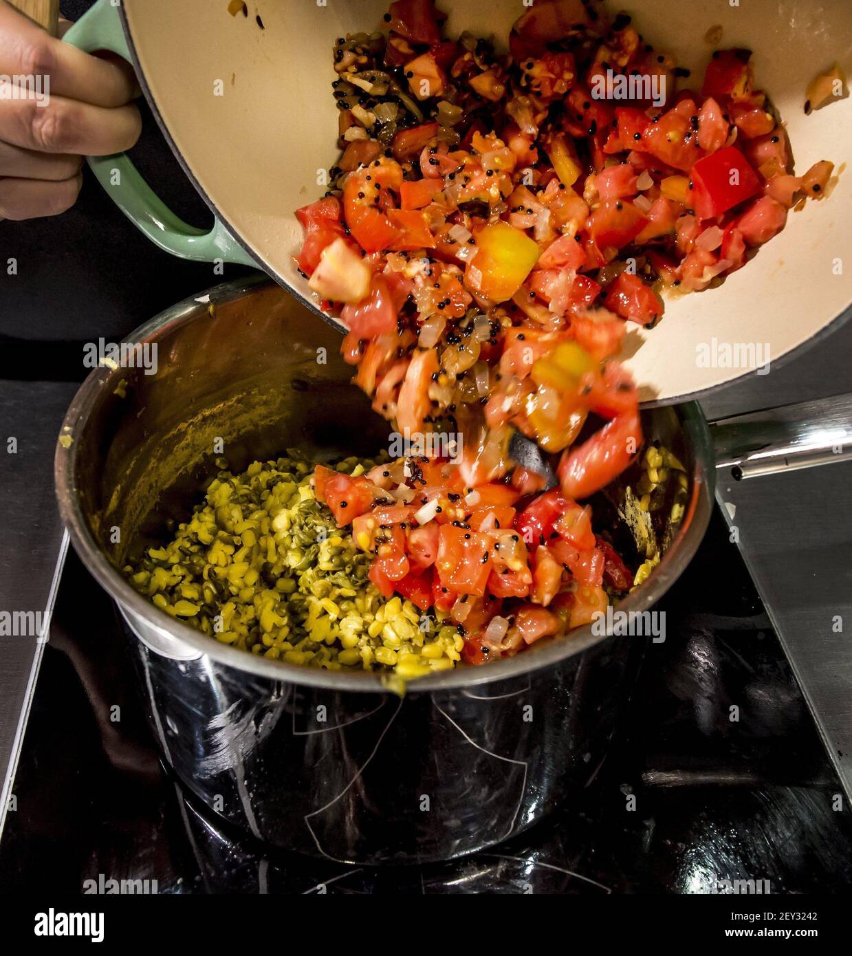 The flavored oil and other ingredients in the tarka are then stirred ...