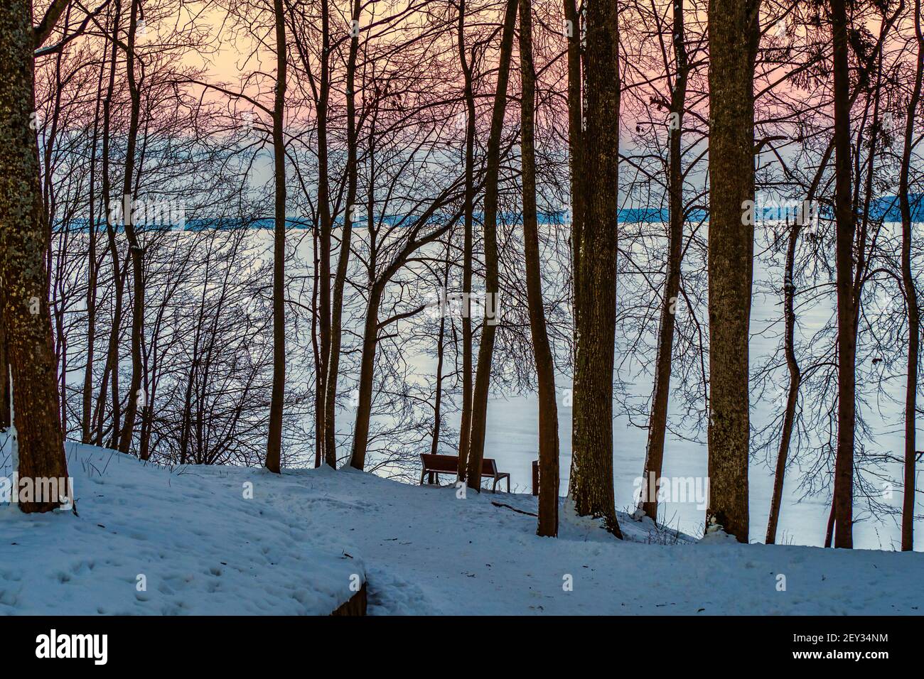 Winter Scene with Colorful Twilight over Frozen Lake Stock Photo - Alamy