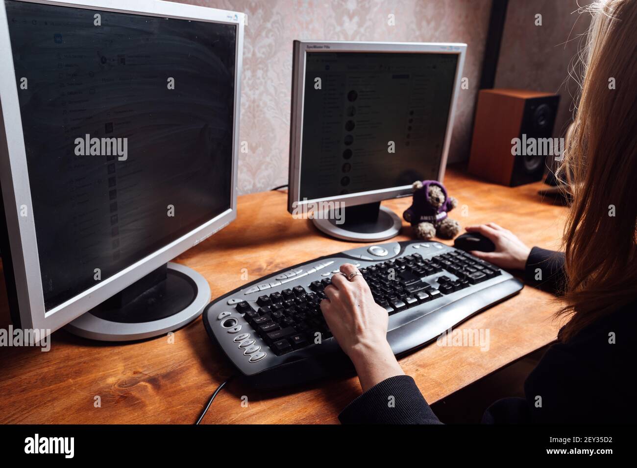 Using two monitors at home office hi-res stock photography and images ...