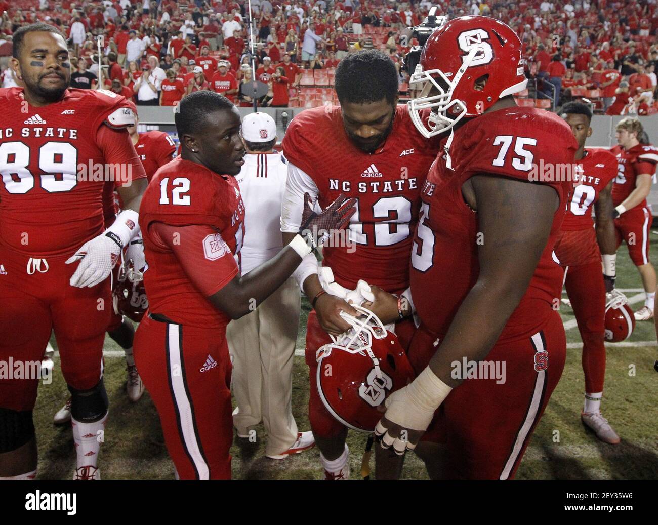 North Carolina State's Nicholas Lacy (12), left, and T.Y. McGill (75 ...