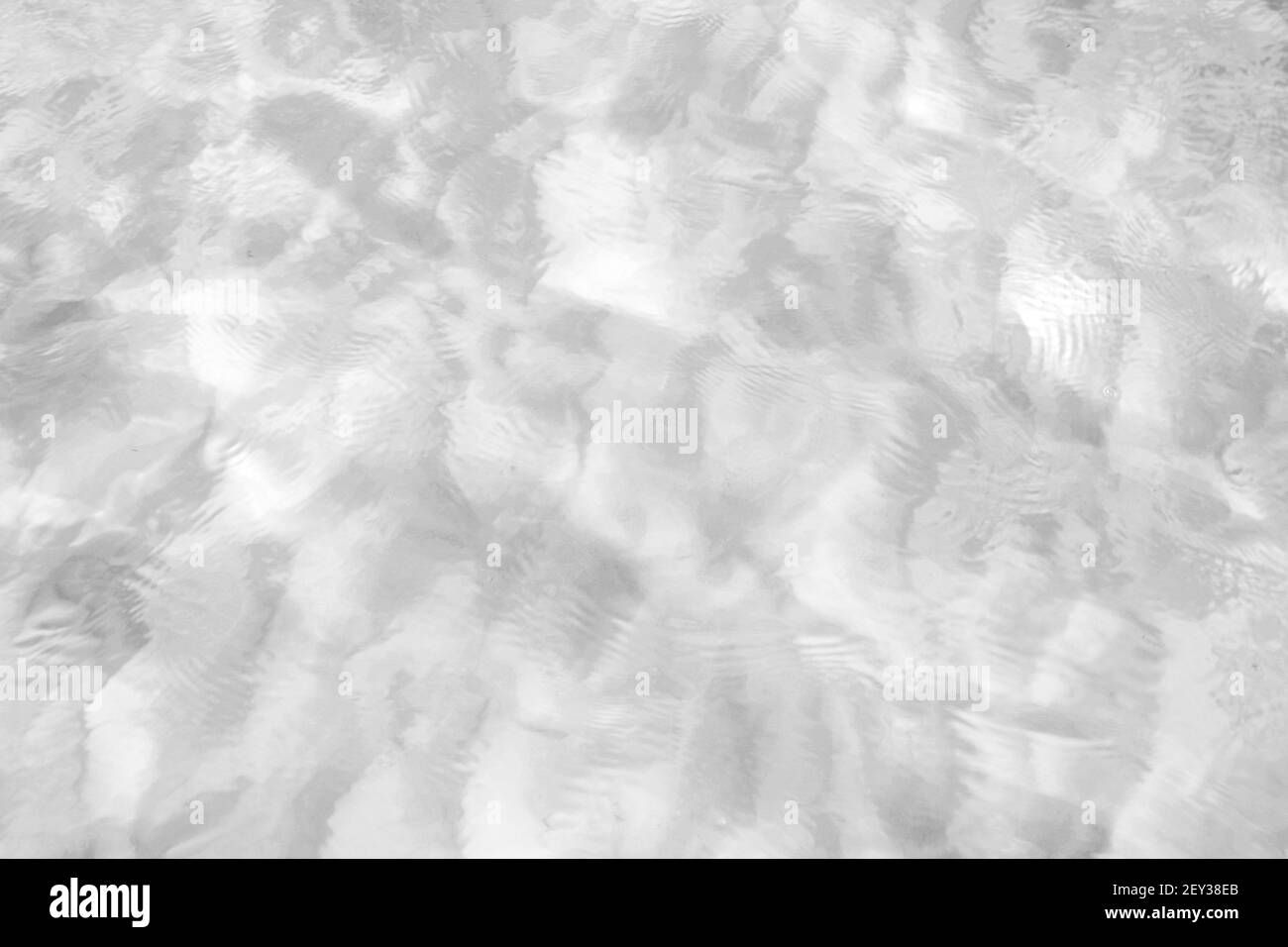 Shadows from the water. Monochrome background with water surface and ...