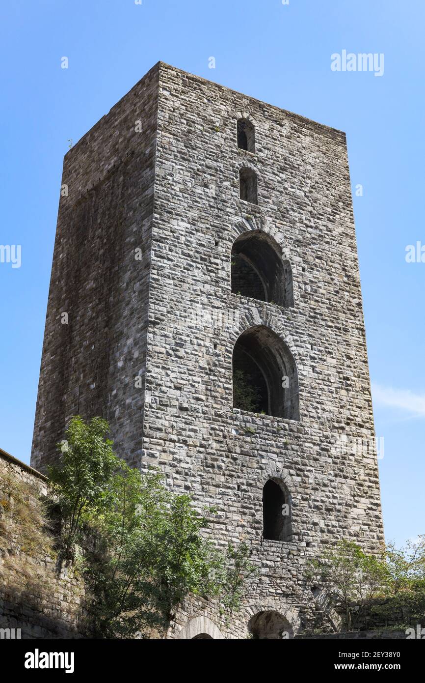 medieval stone castle tower with blue sky background Como Europe Stock ...